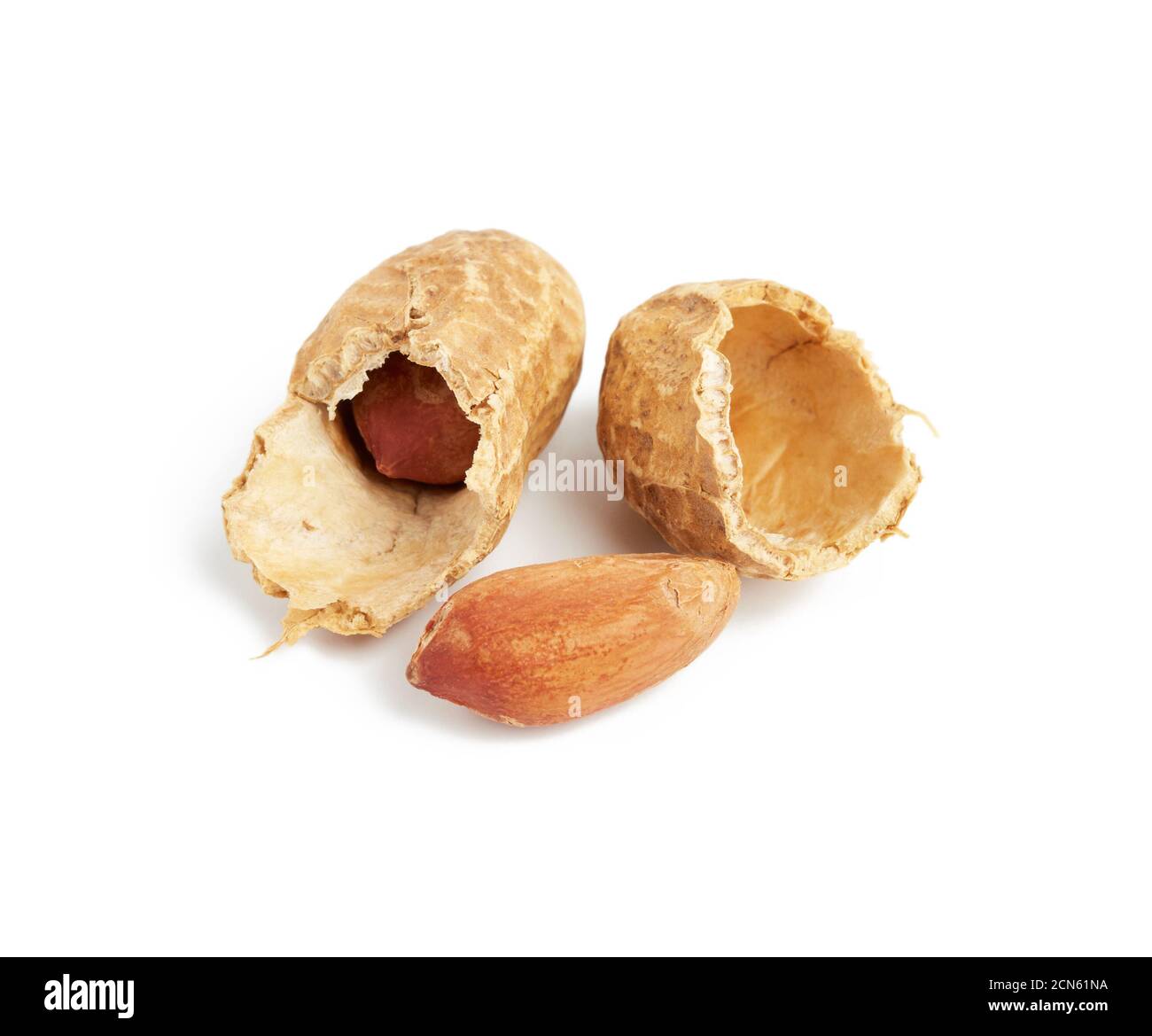 inshell peanuts broken in half, food isolated on white background Stock ...