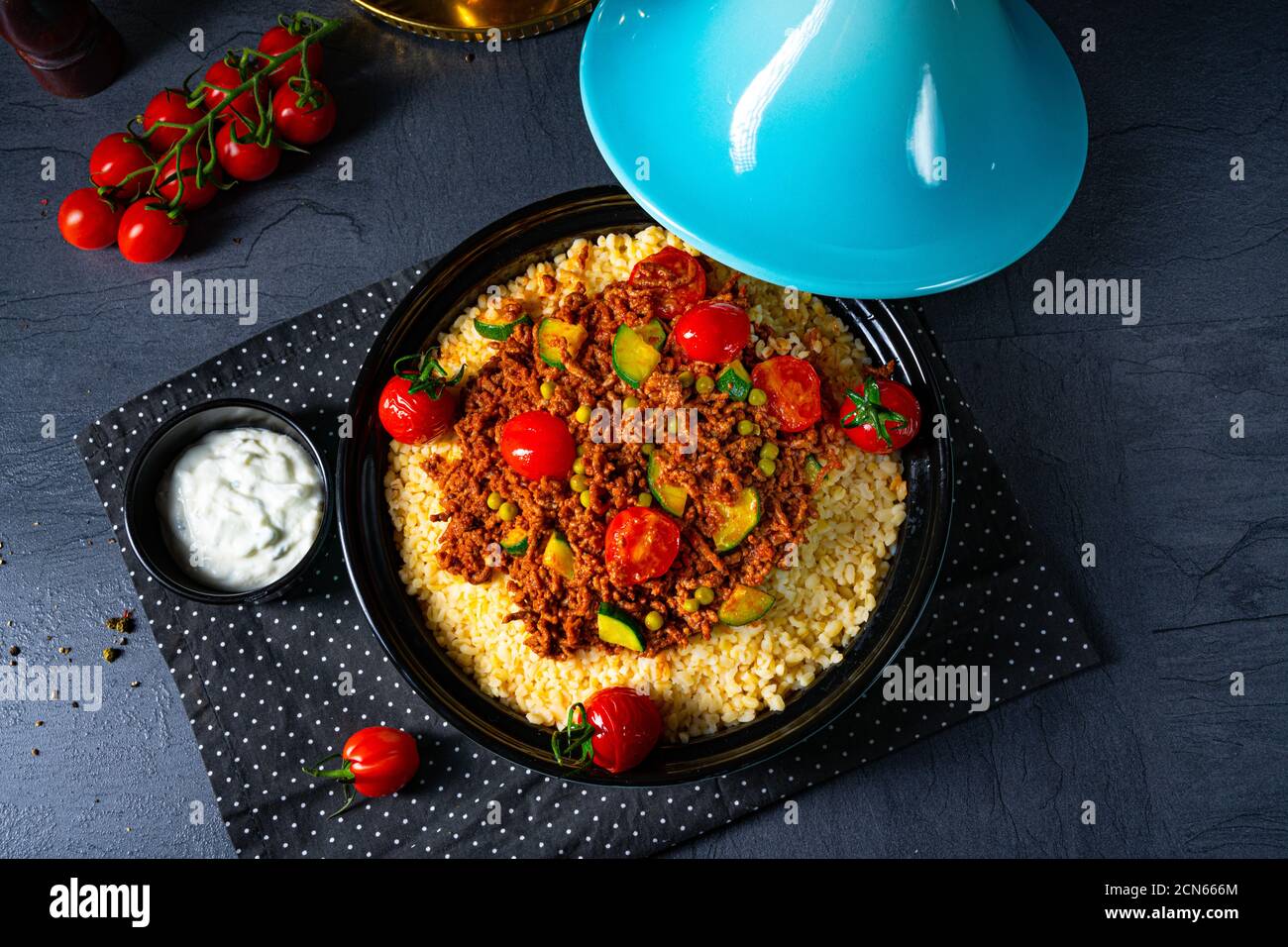 Tomato bulgur with vegetables and minced meat Stock Photo - Alamy