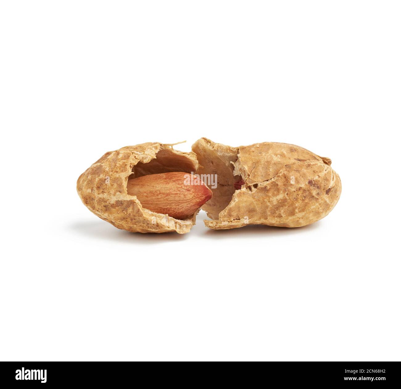 inshell peanuts broken in half, food isolated on white background Stock ...