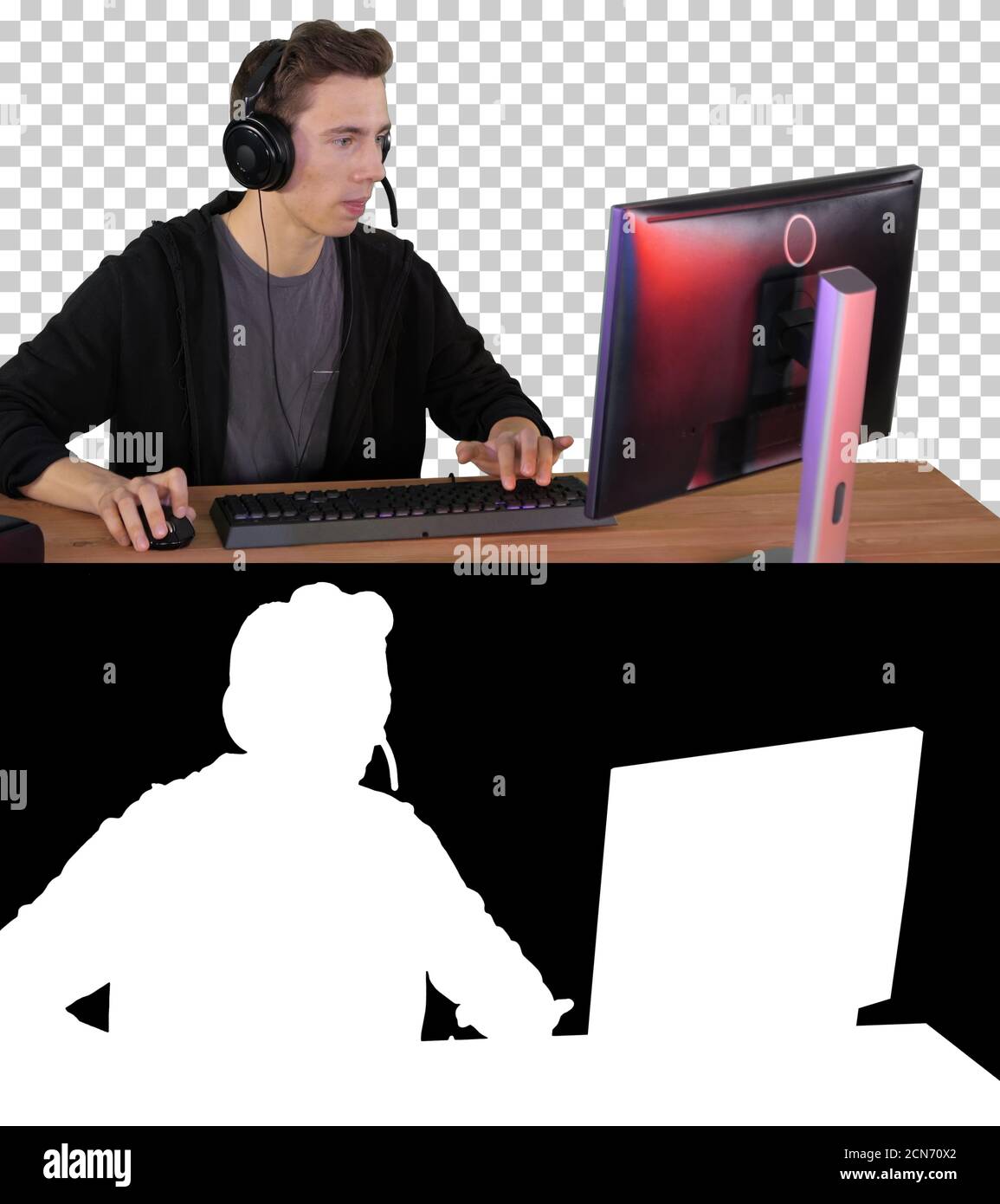 Gamer guy in headphones playing video games on computer and winn Stock ...