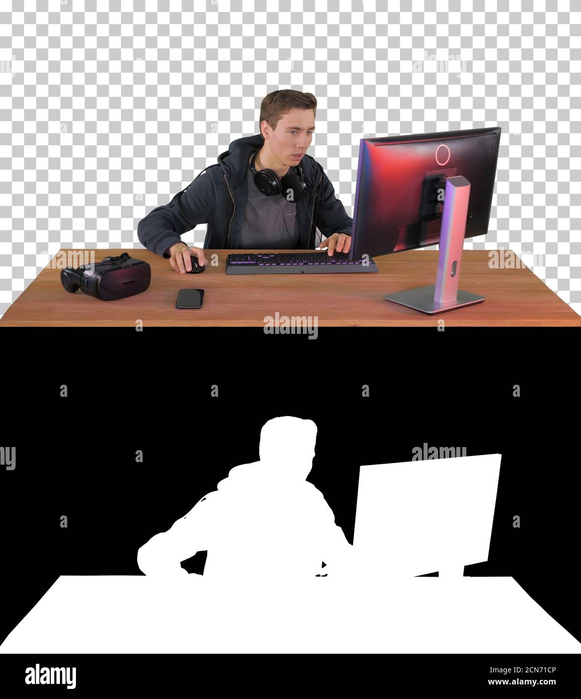 Gamer guy with headphones playing video games on computer and sh Stock ...