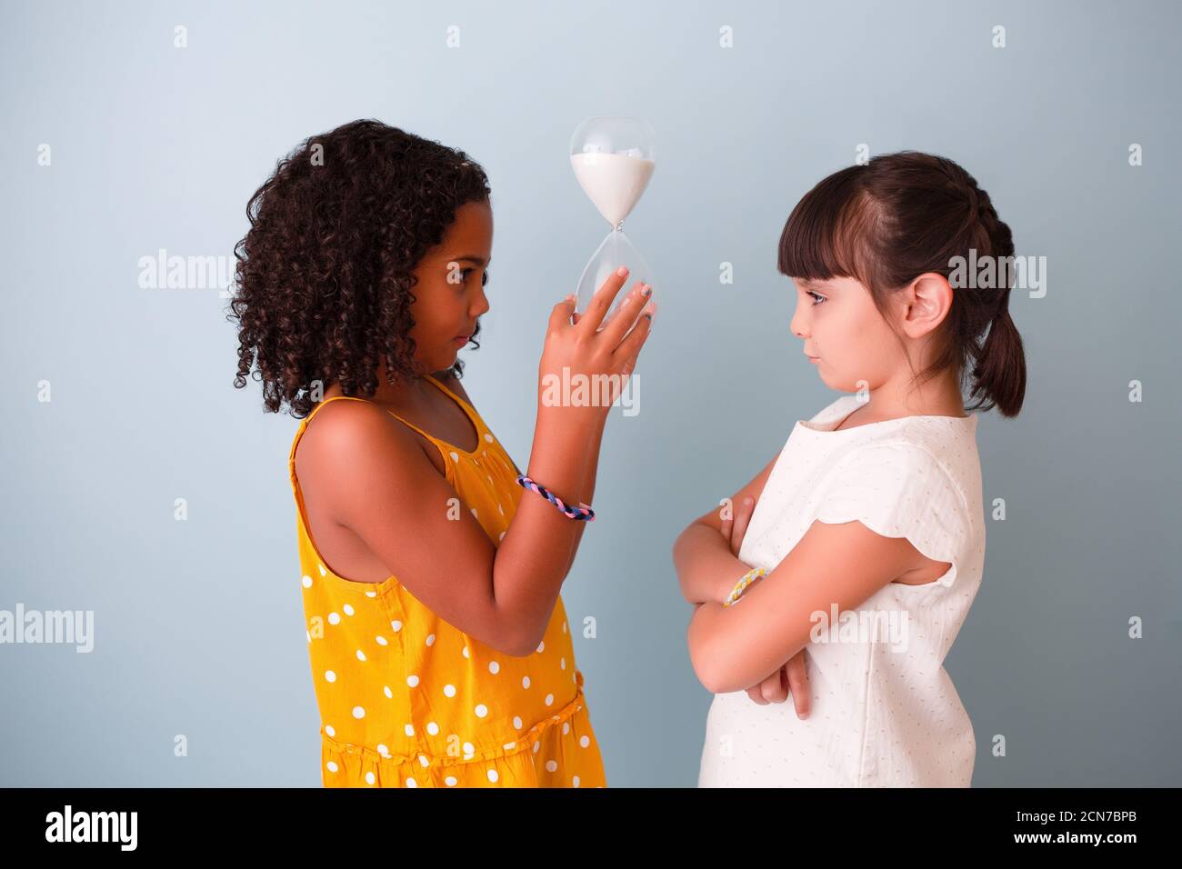 Two Kids Watching the Timer Stock Photo - Alamy