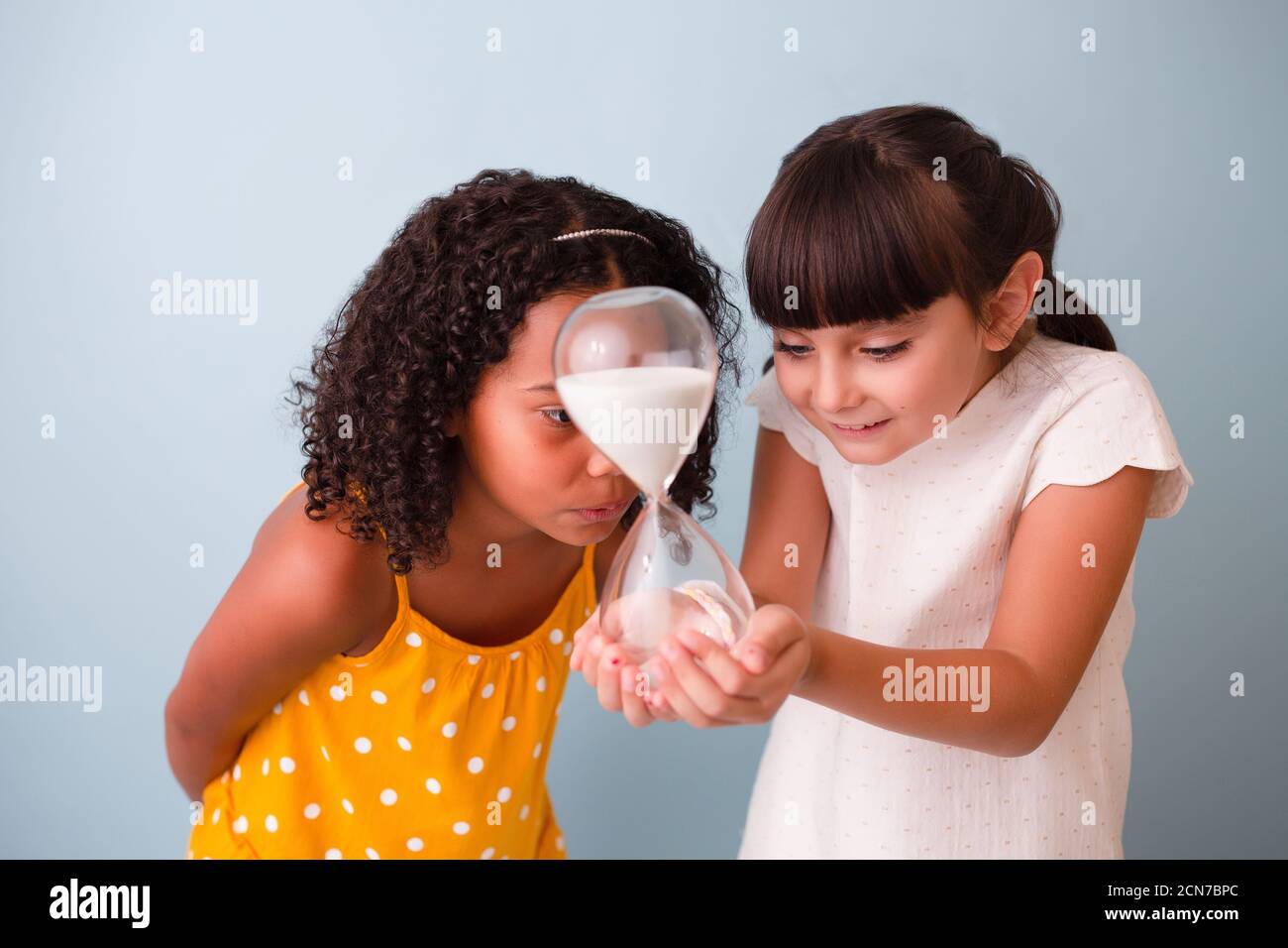 Two Kids Watching the Timer. They look excited Stock Photo - Alamy