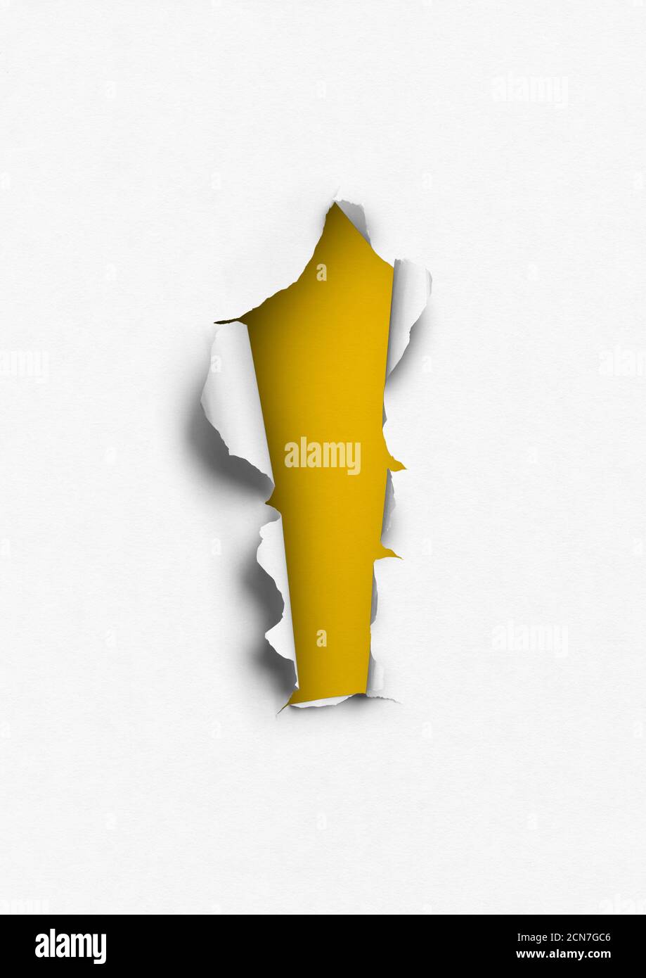 Torn paper with yellow hole Stock Photo - Alamy