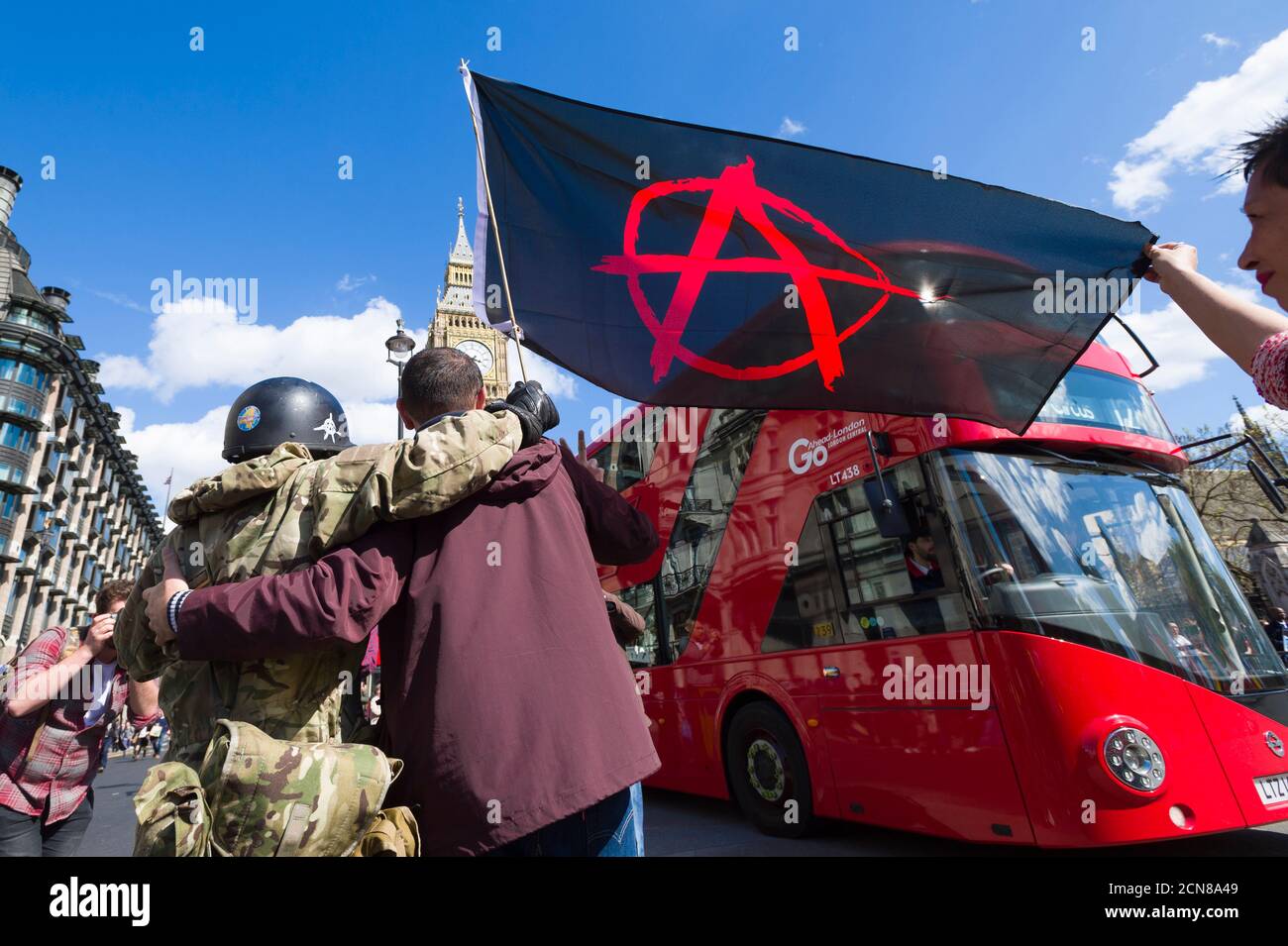 A anti austerity demonstrator hold an anarchy flag, protesting against ...