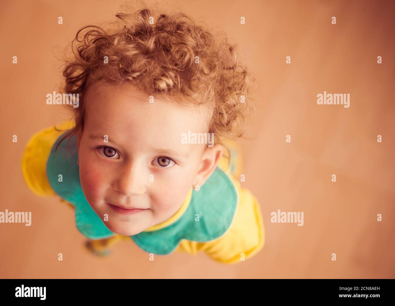 little cute girl portrait from up angle Stock Photo - Alamy