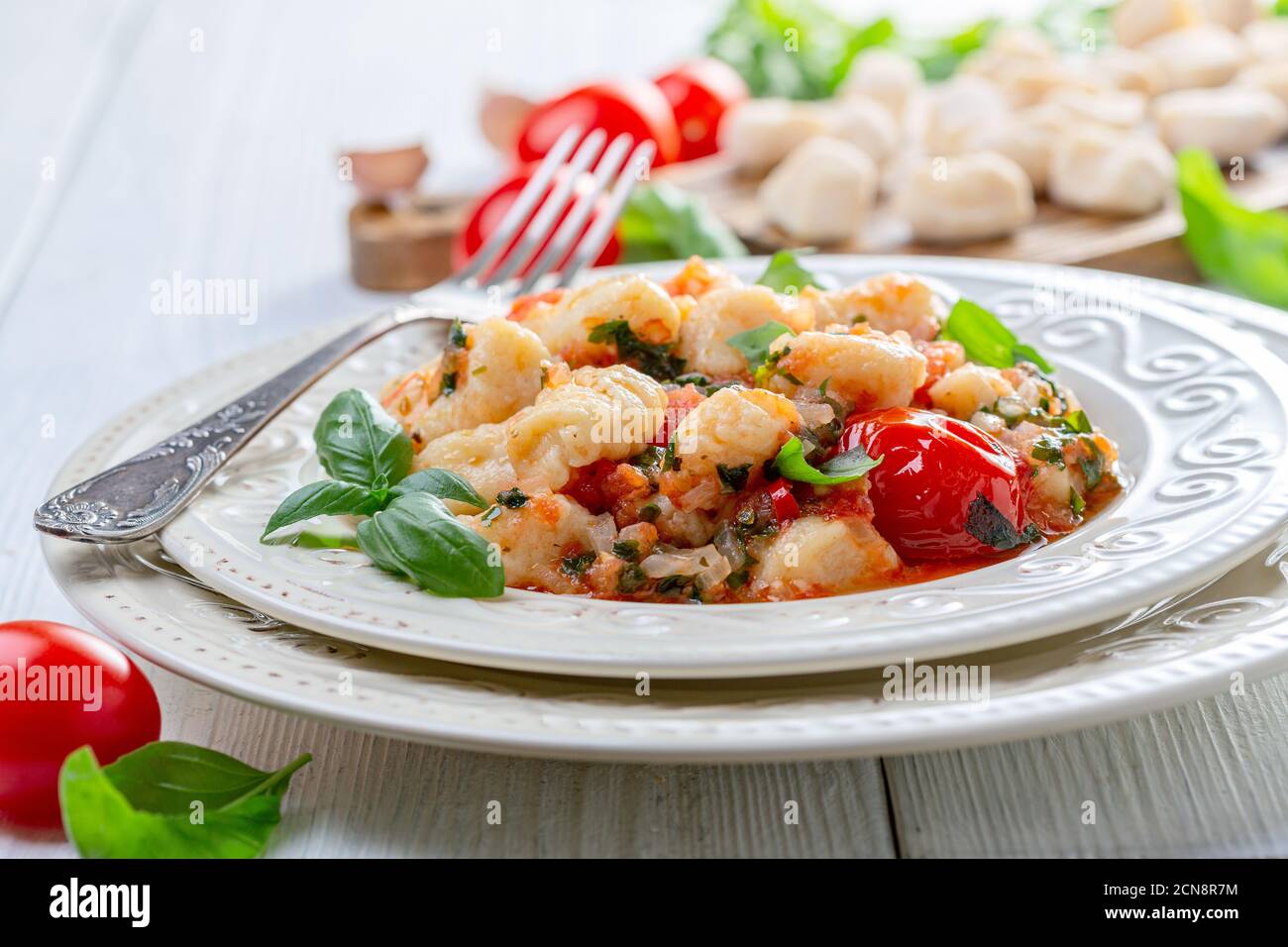 Traditional potato gnocchi with tomato sauce Stock Photo - Alamy