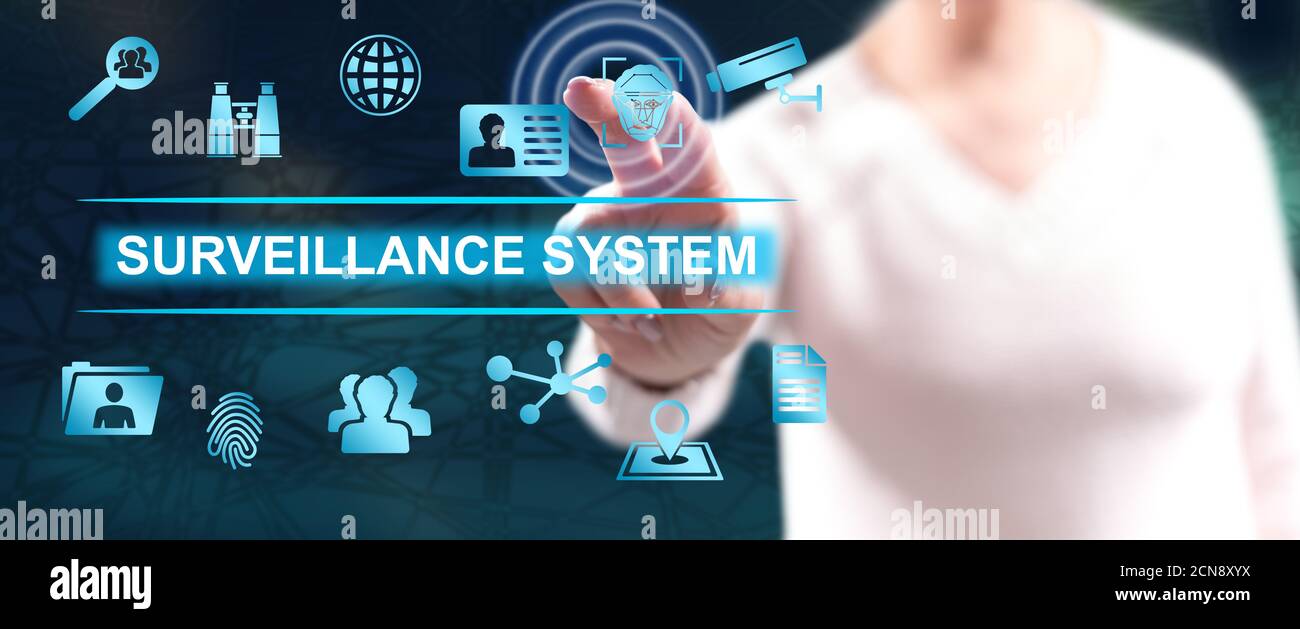 Woman touching a surveillance system concept on a touch screen with her ...