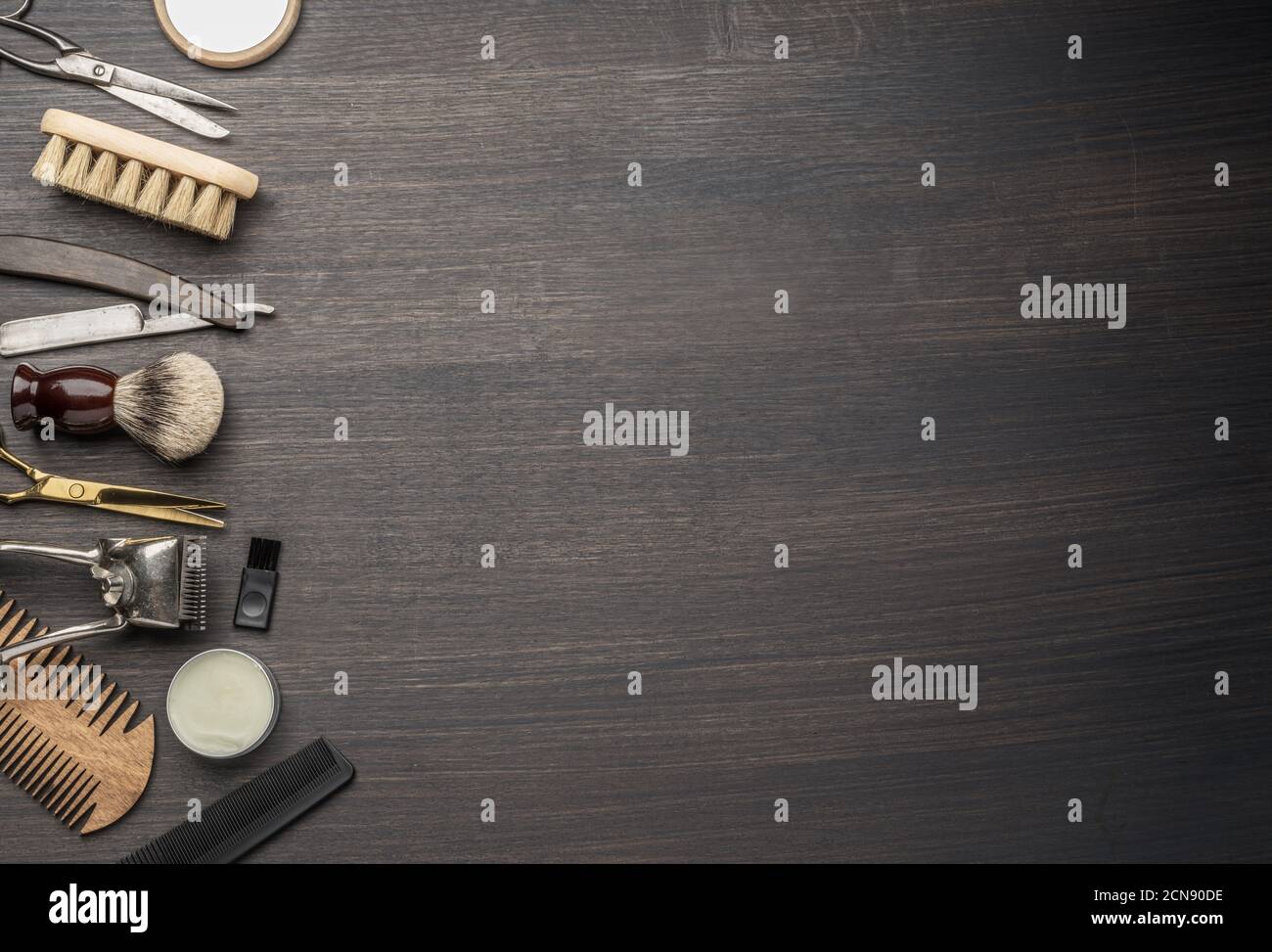 Classic grooming and hairdressing tools on wooden background. Top view ...