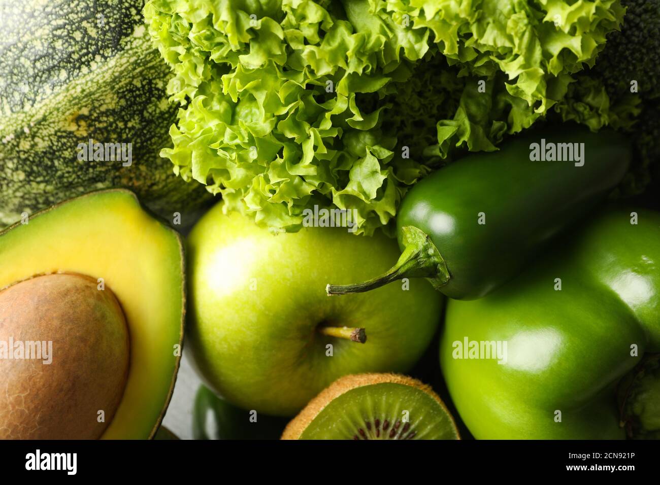 Green vegetables and fruits on whole background, close up Stock Photo ...
