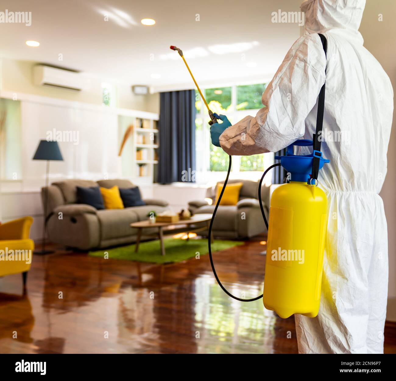 Asian man in PPE disinfection from COVID-19 at home Stock Photo - Alamy