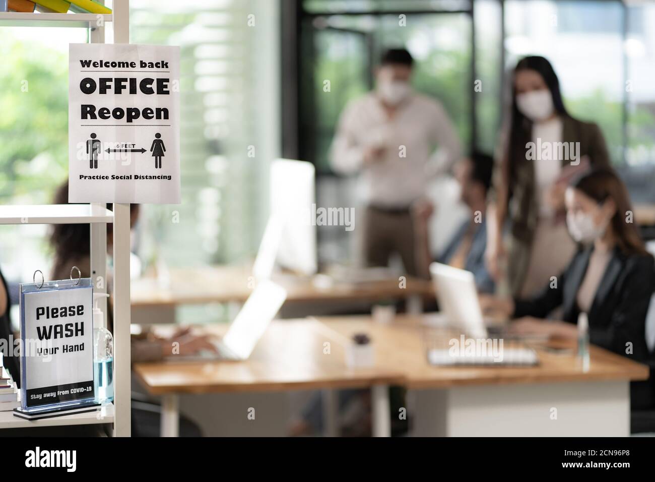 Office reopen with social distance signage Stock Photo - Alamy