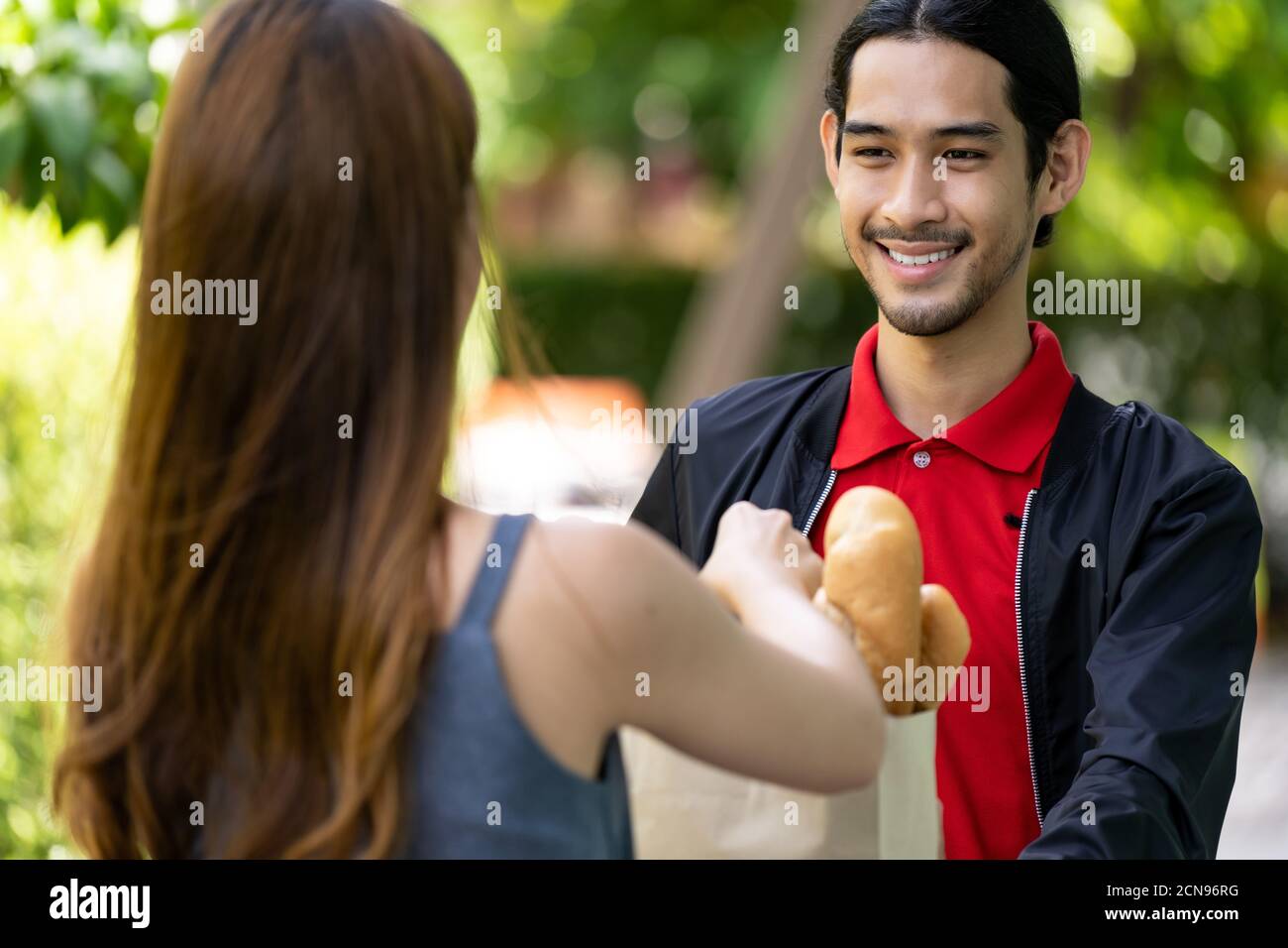 Deliverly man pick up order Stock Photo - Alamy
