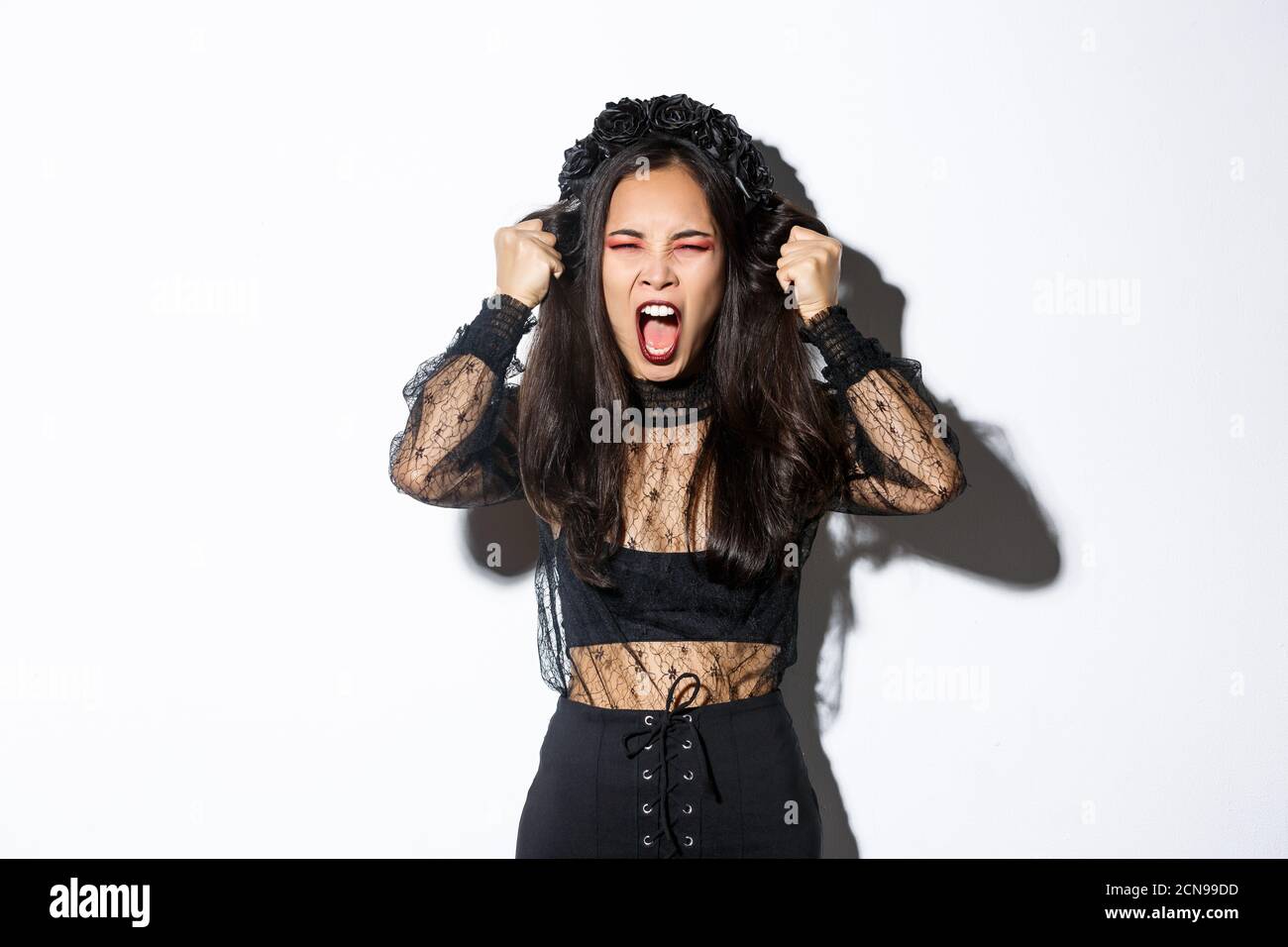 Image of angry distressed asian woman screaming and ripping hair of ...