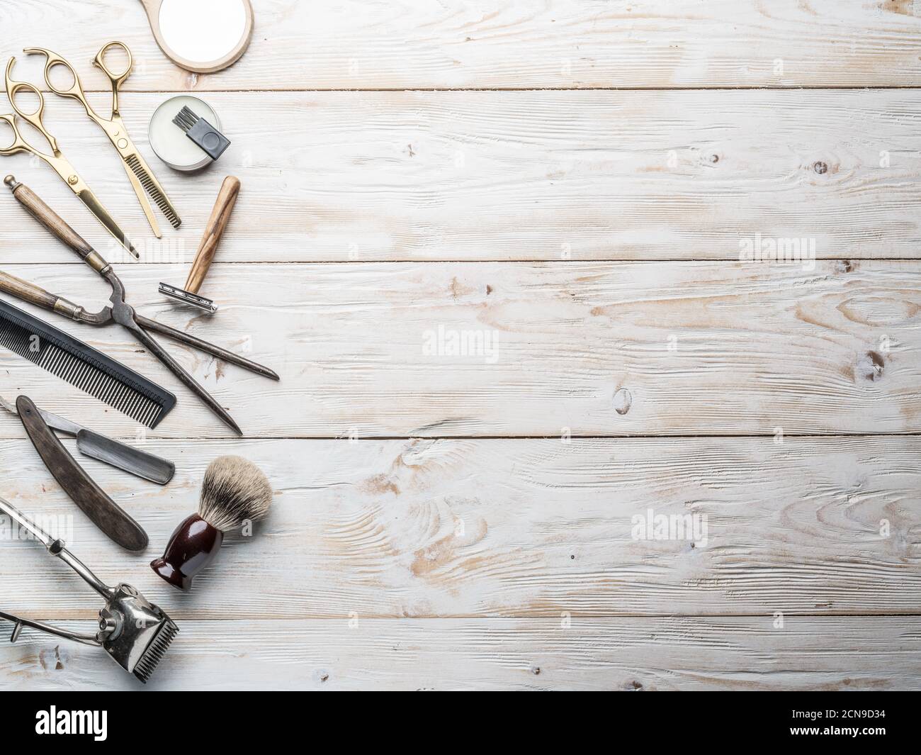 Classic grooming and hairdressing tools on wooden background. Top view ...