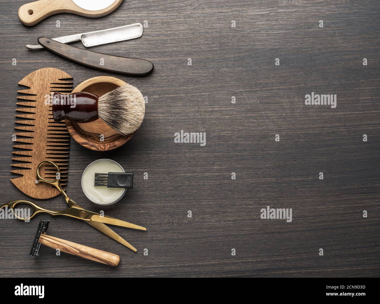 Classic grooming and hairdressing tools on wooden background. Top view ...