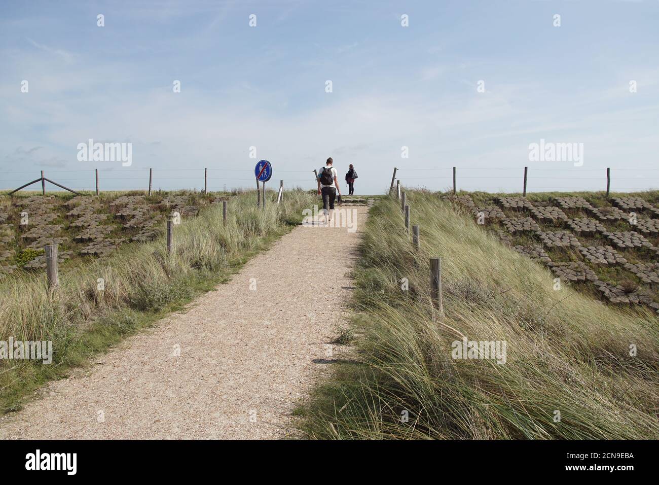 Footpath to the top of a Dutch dyke, seawall as protection against the ...