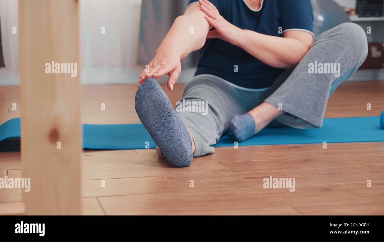 Old woman stretching hi-res stock photography and images - Alamy