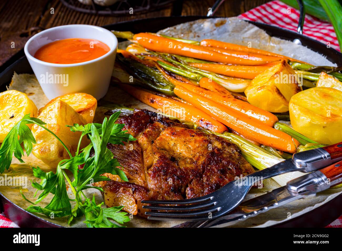 grilled neck chops with caramelized vegetables Stock Photo - Alamy