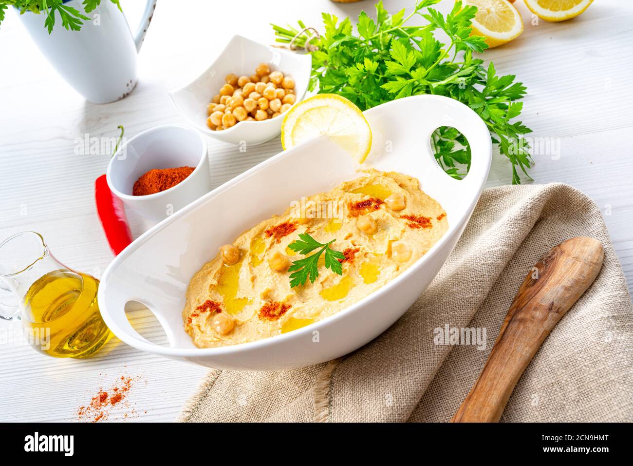 hummus paste with lemon and chilli on white background Stock Photo - Alamy