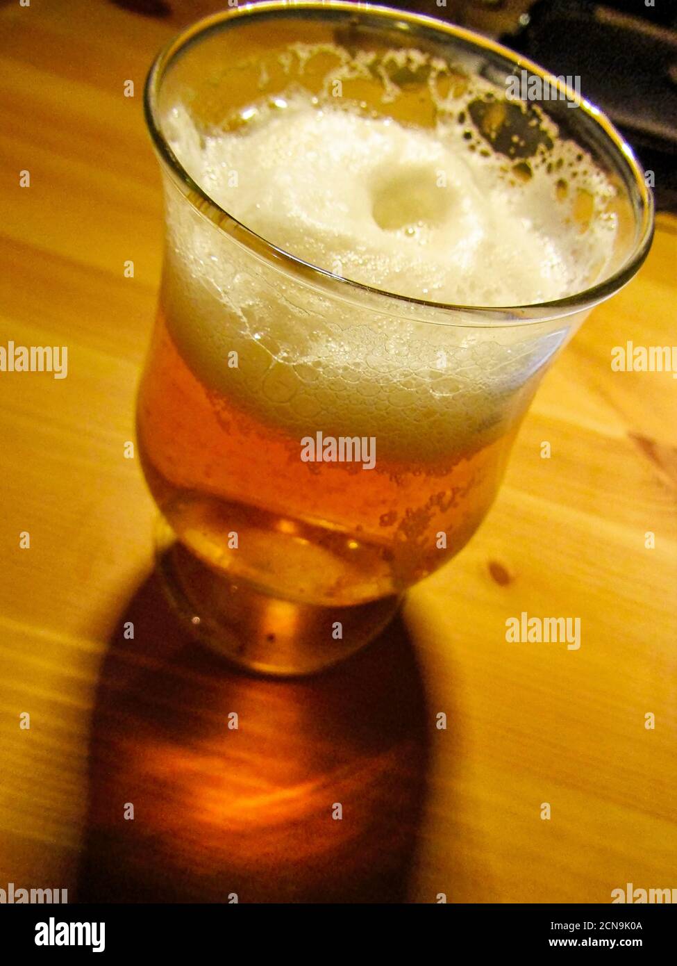 A glass of Beer on a table at night, Crete, Greece Stock Photo - Alamy