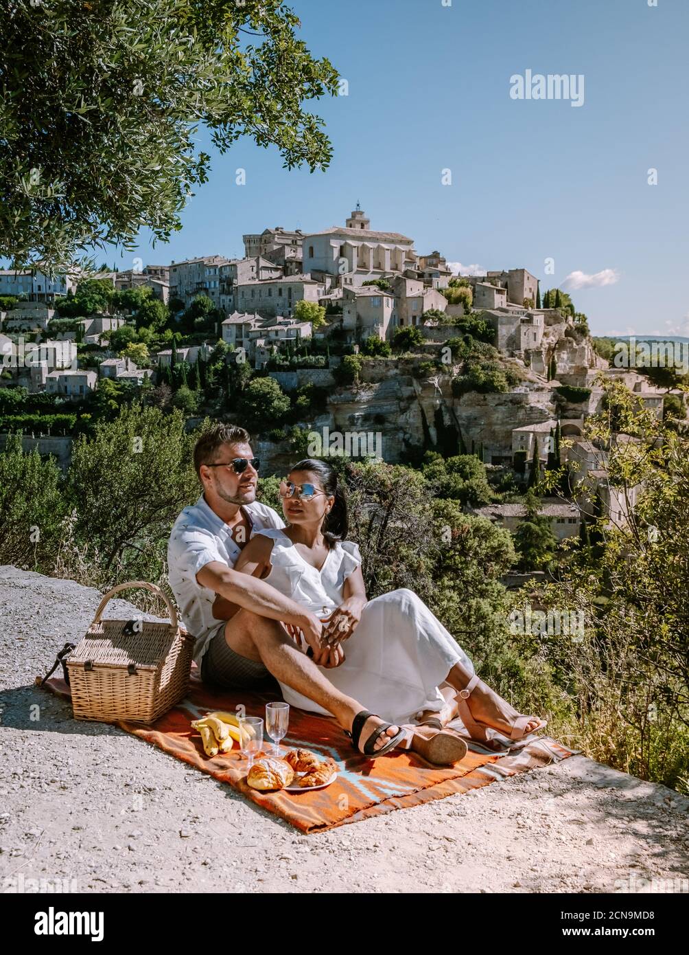 couple visit the old town of Gordes Provence,Blooming purple lavender ...