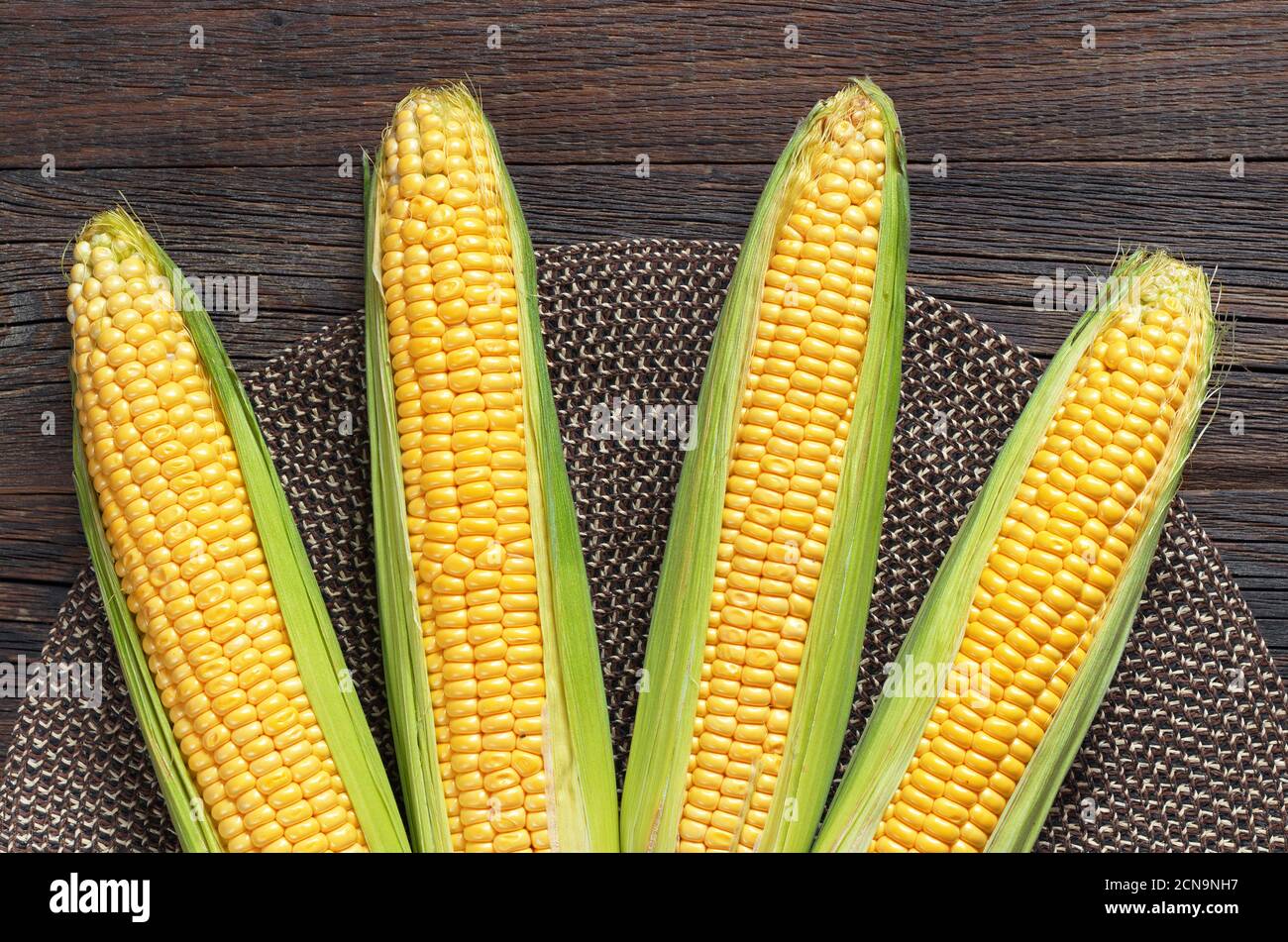Ripe sweet corn on rustic wooden table, top view Stock Photo - Alamy