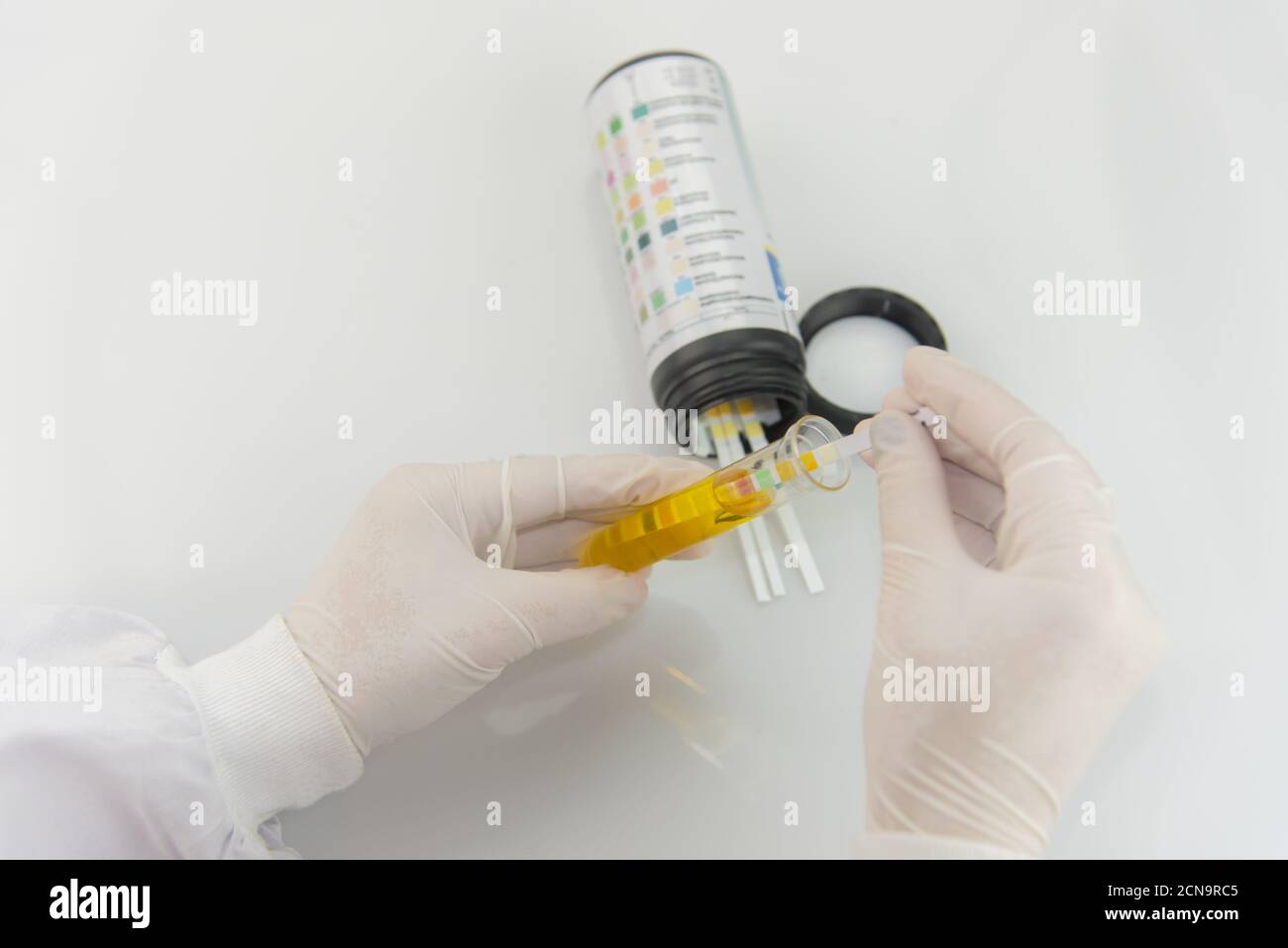 Urine sample test in laboratory,Urine strip test Stock Photo - Alamy