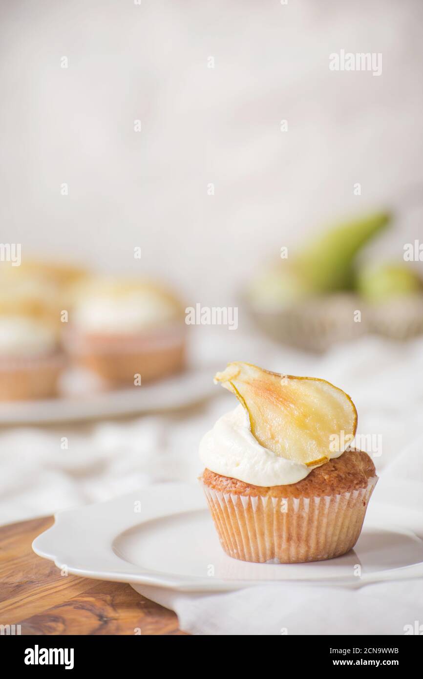 Bright pear cupcakes with frosting Stock Photo - Alamy
