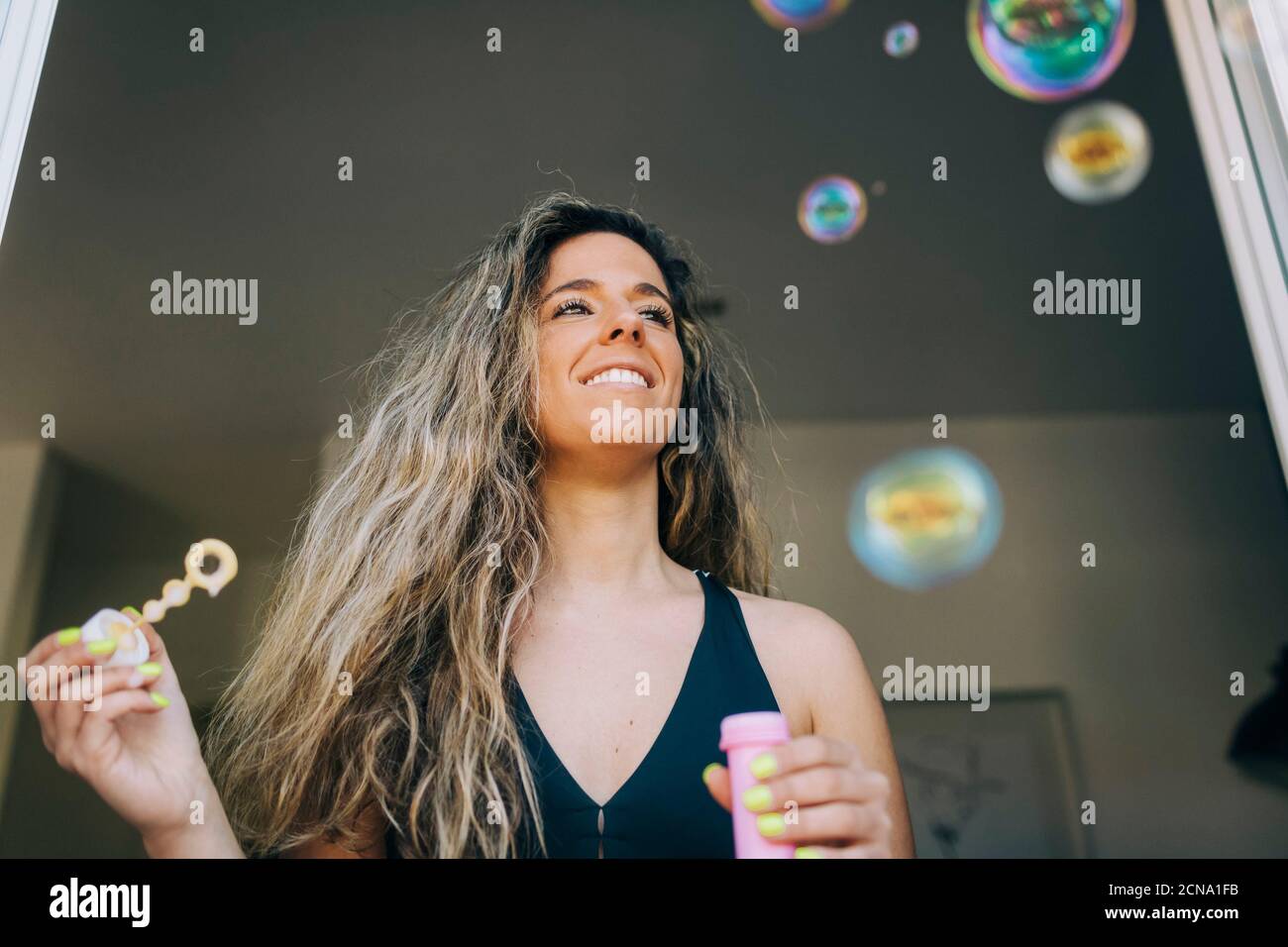Happy floating bubble woman hi-res stock photography and images - Alamy