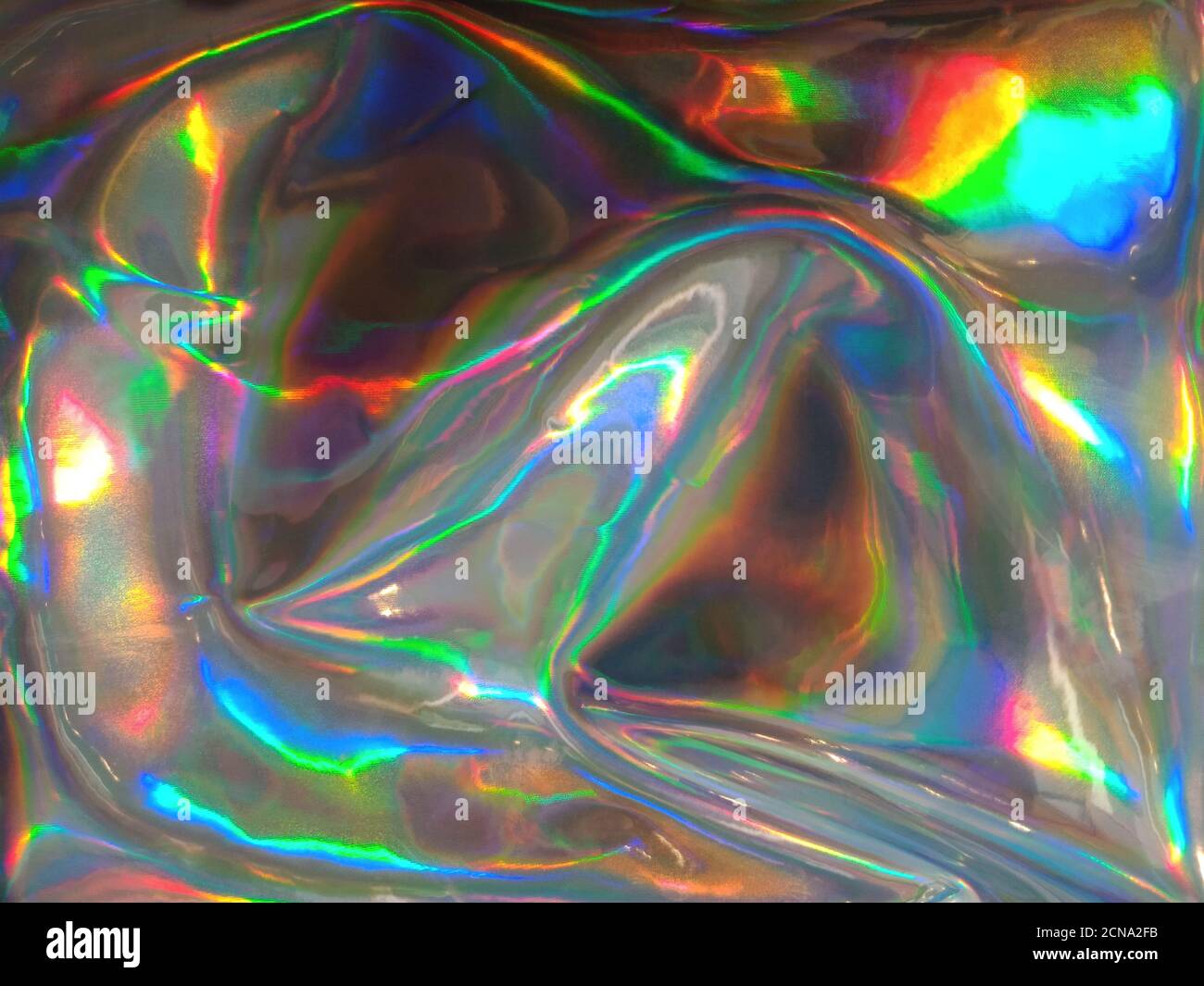 Holographic bright rainbow multicolor real crumpled texture background ...