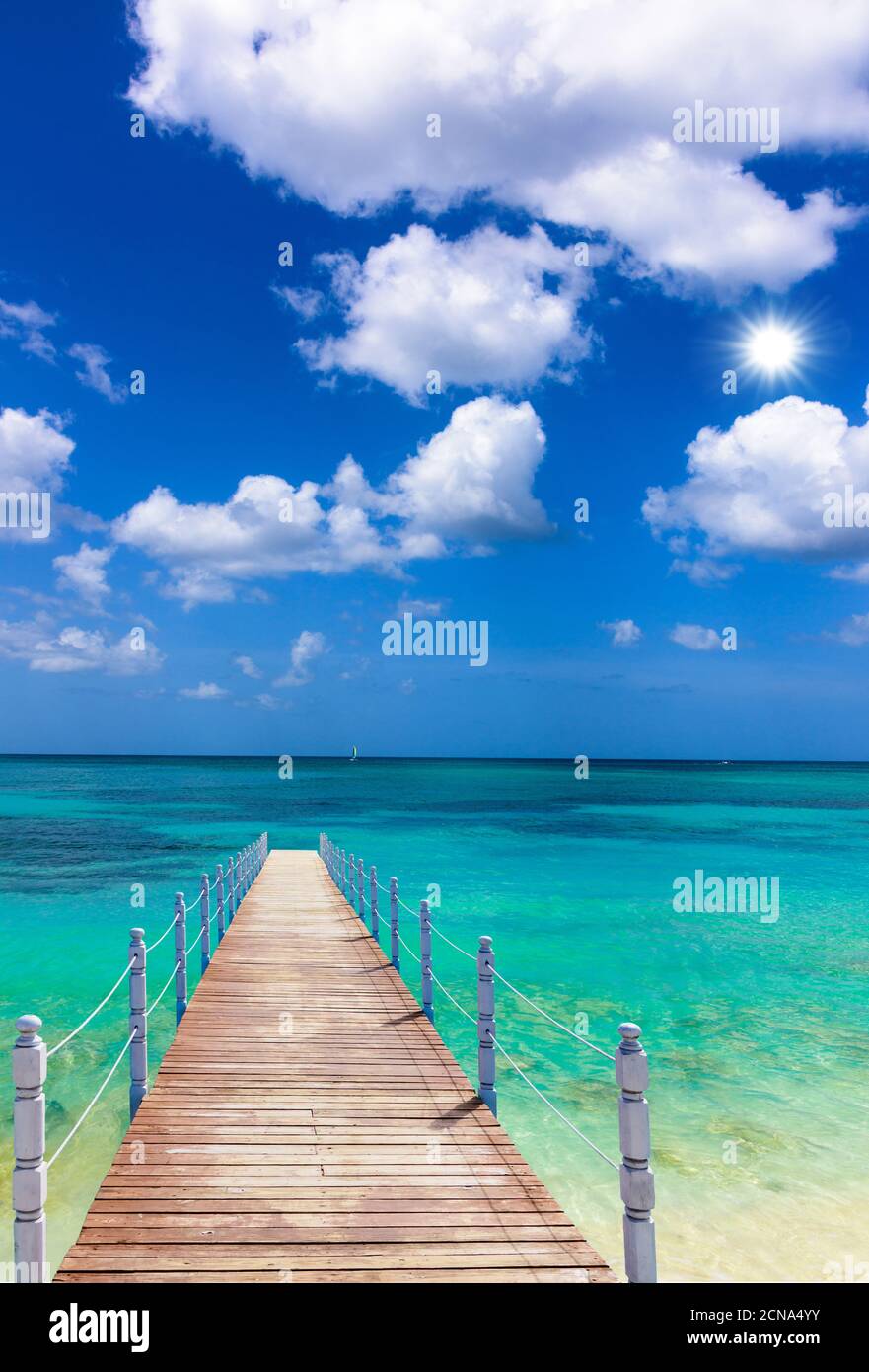 wooden bridge juts out into of the sea Stock Photo - Alamy