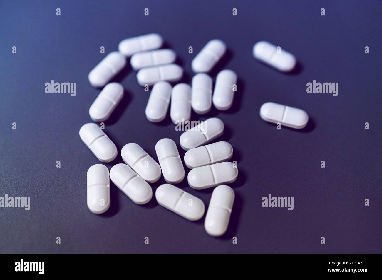 Prescription medication on purple background Stock Photo - Alamy