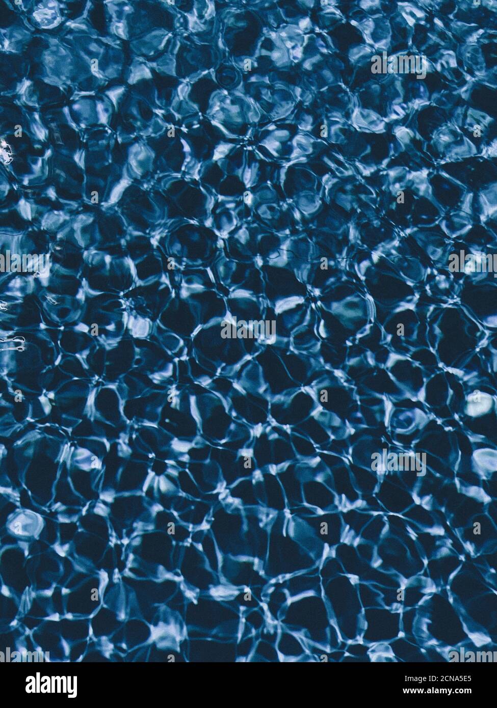 Blue swimming pool ripple pattern Stock Photo - Alamy