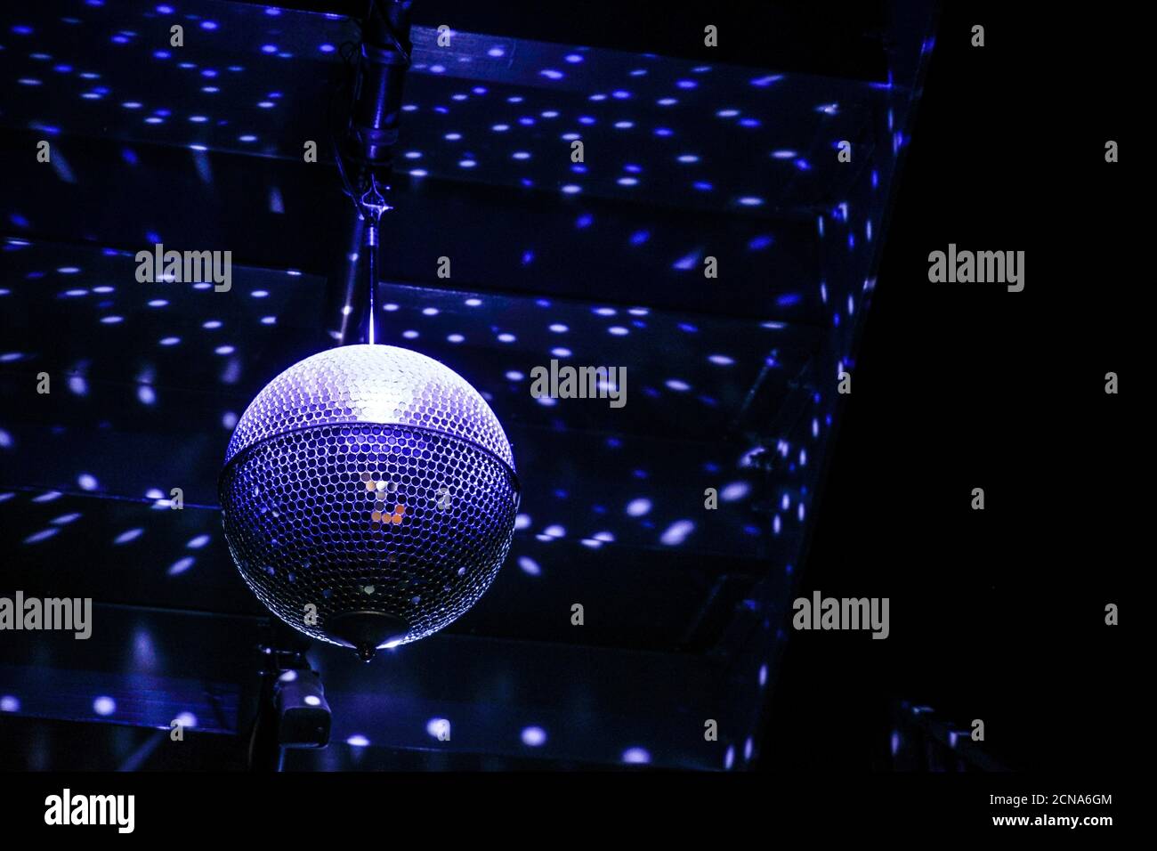 Purple mirror ball Stock Photo - Alamy