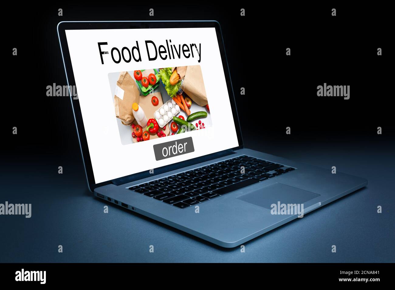 Food take away website in a laptop screen. Lunch at the office Stock ...