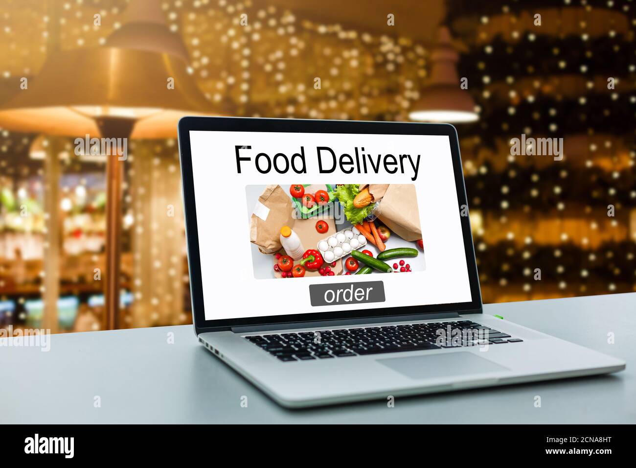 Food take away website in a laptop screen. Lunch at the office Stock ...
