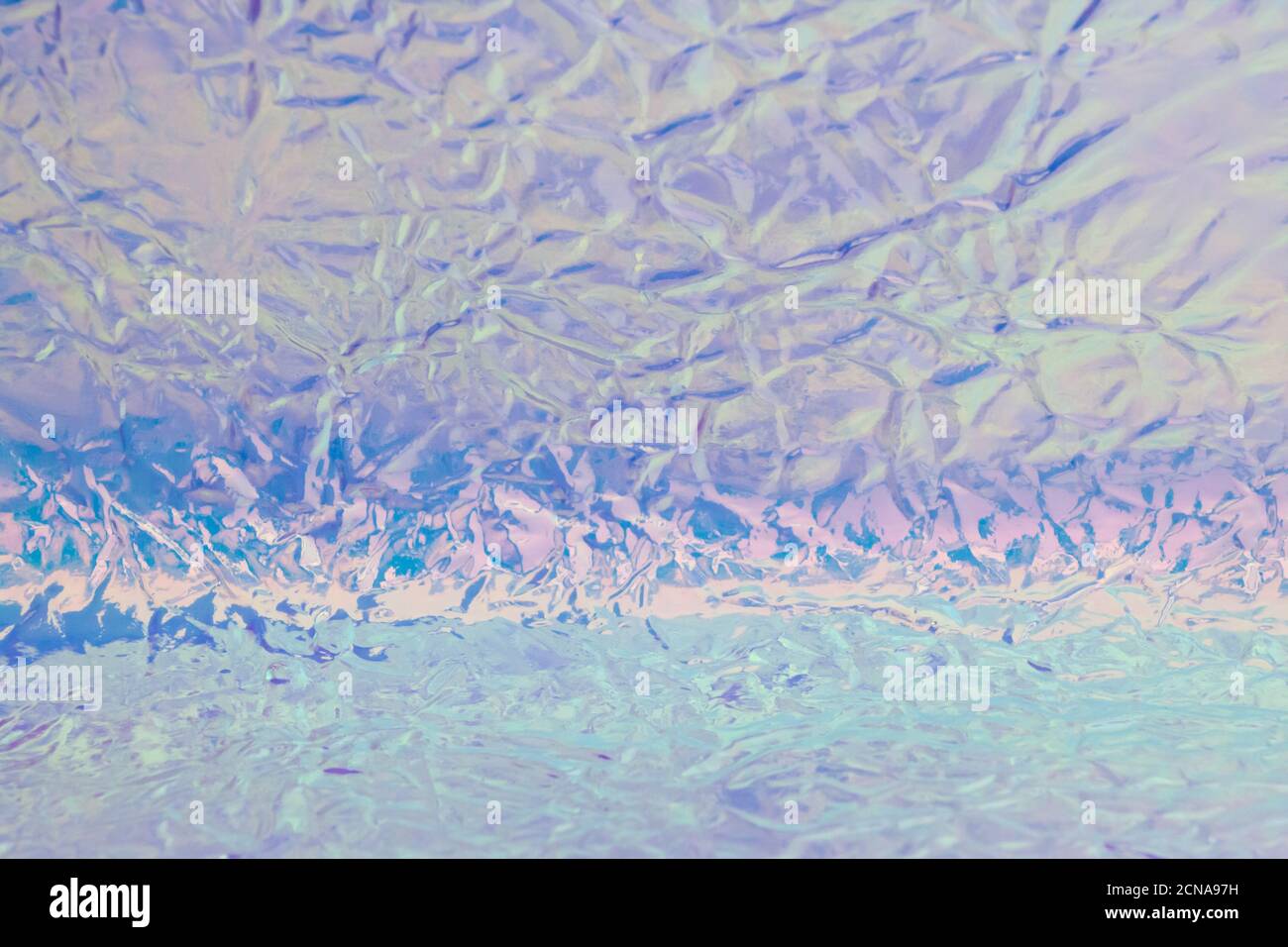 Holographic bright rainbow multicolor real crumpled texture background ...