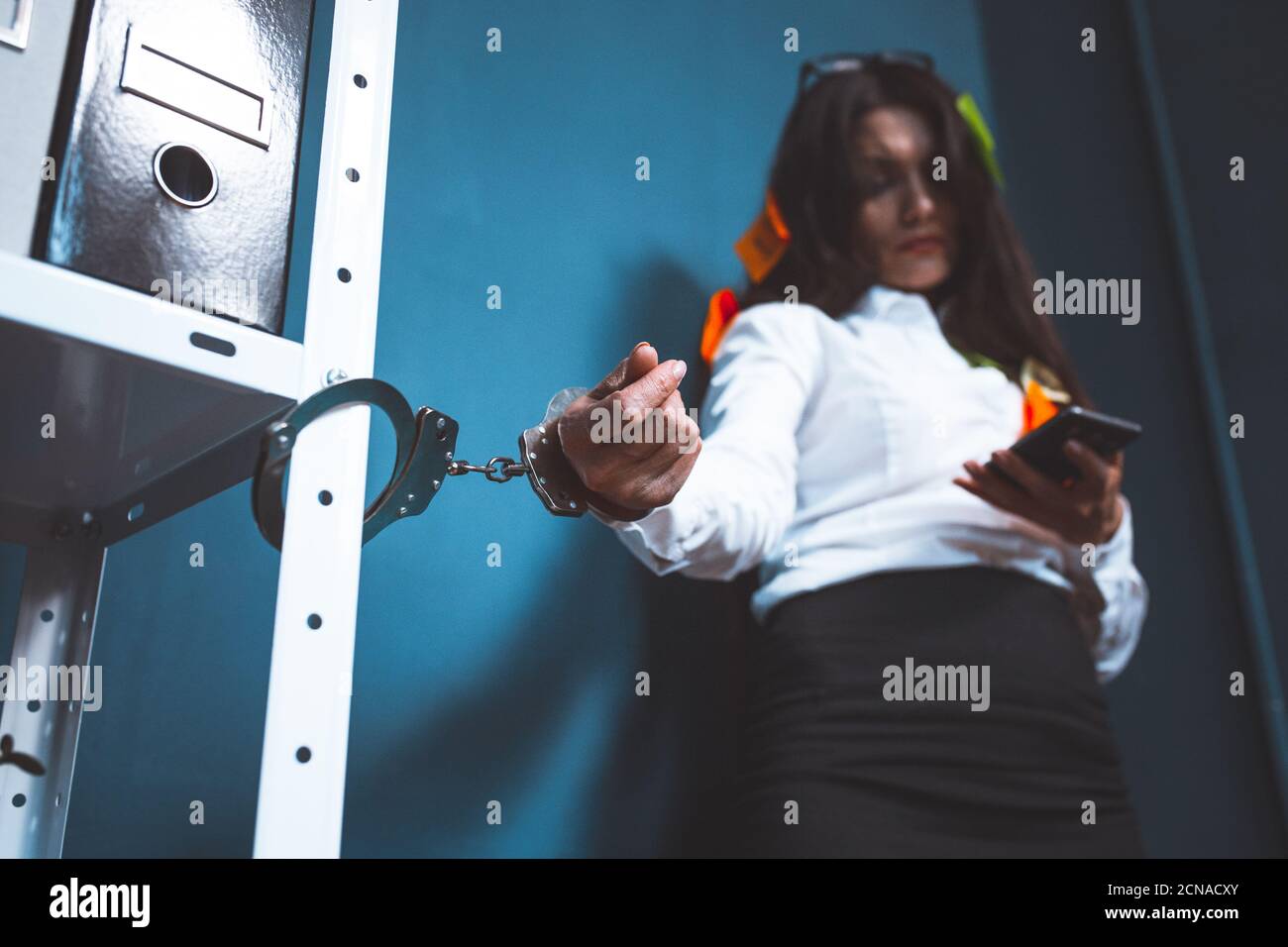 Female prisoner and handcuffs hi-res stock photography and images - Alamy