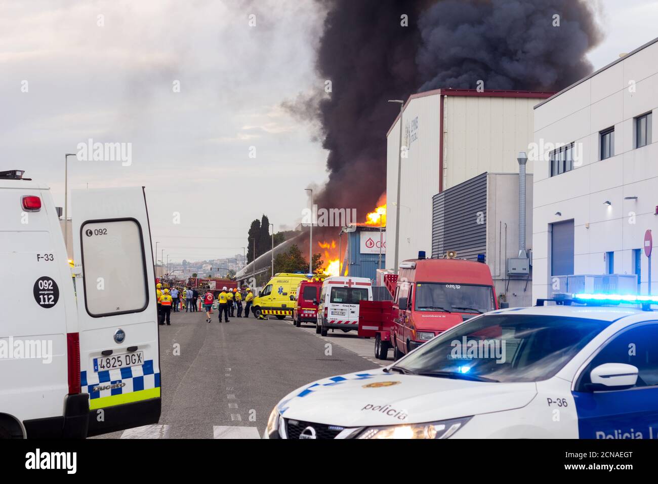 Firefighters, police, toilets, ambulances in a factory fire. Fire ...