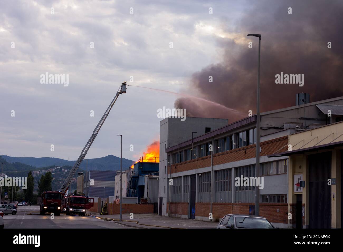 Firefighters, police, toilets, ambulances in a factory fire. Fire ...
