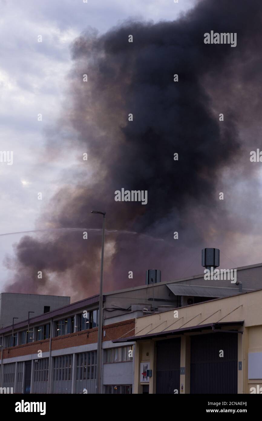 Firefighters, police, toilets, ambulances in a factory fire. Fire ...