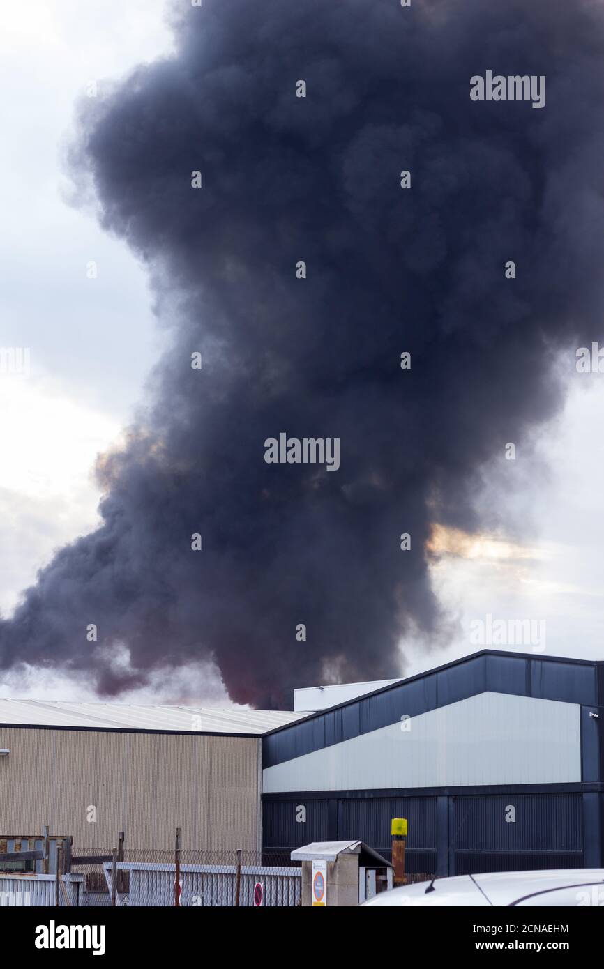 Firefighters, police, toilets, ambulances in a factory fire. Fire ...