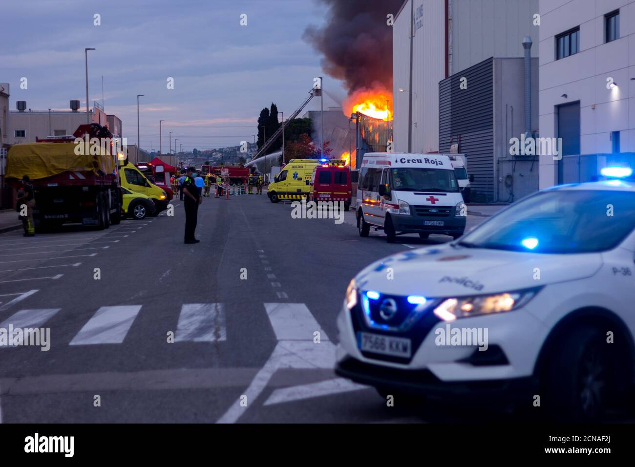 Firefighters, police, toilets, ambulances in a factory fire. Fire ...
