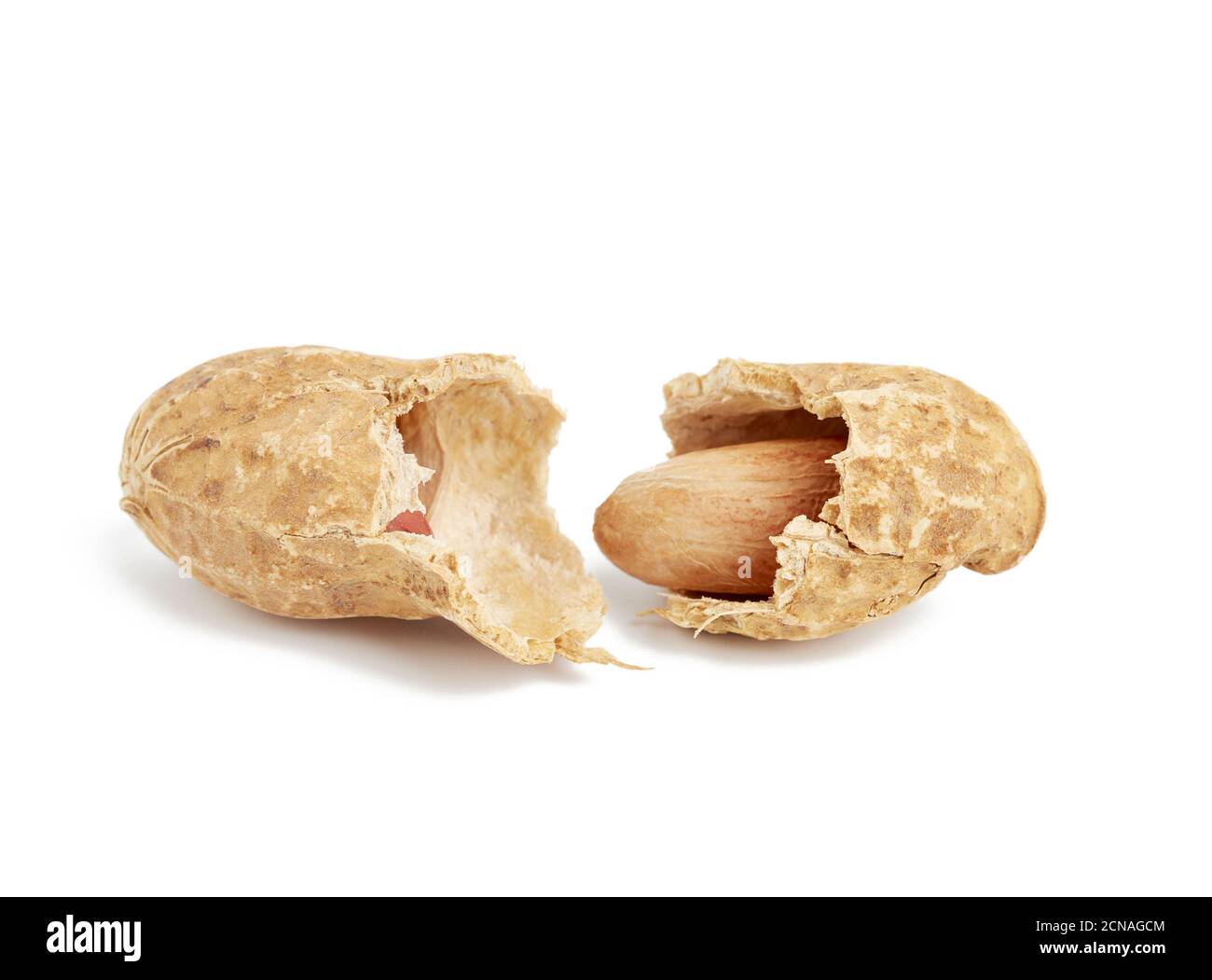 inshell peanuts broken in half, food isolated on white background Stock Photo - Alamy