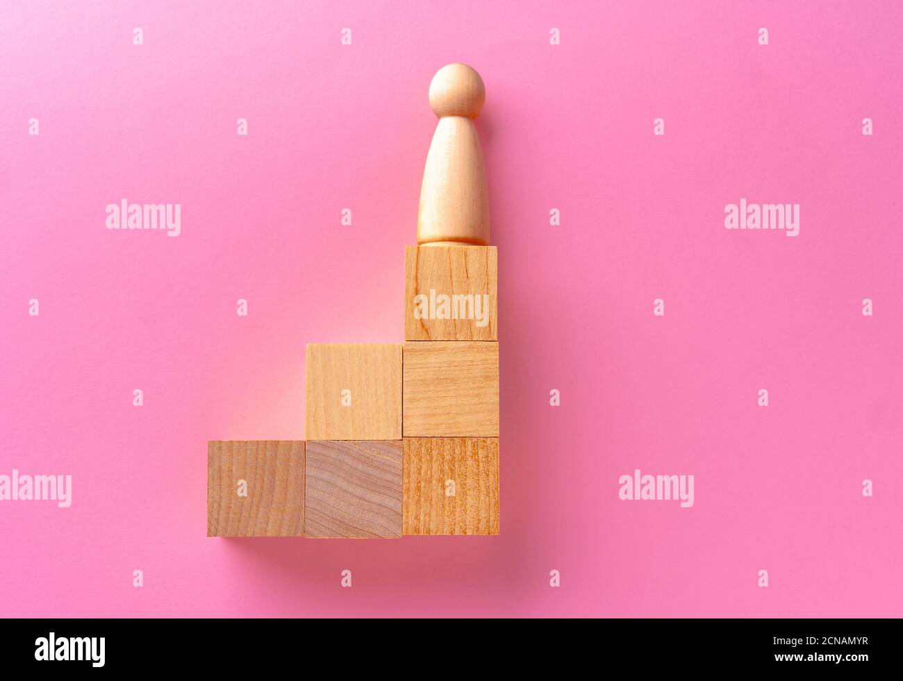 Top view of toy wooden blocks on pink Stock Photo - Alamy