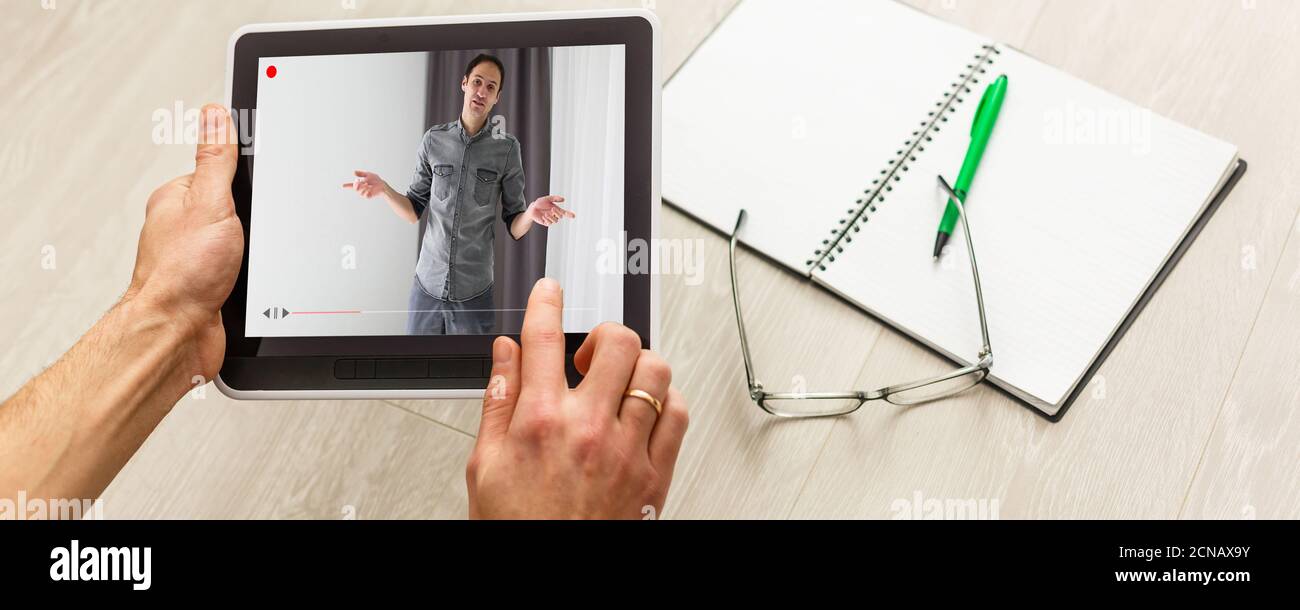 video LESSONS on the tablet screen, learning online Stock Photo - Alamy