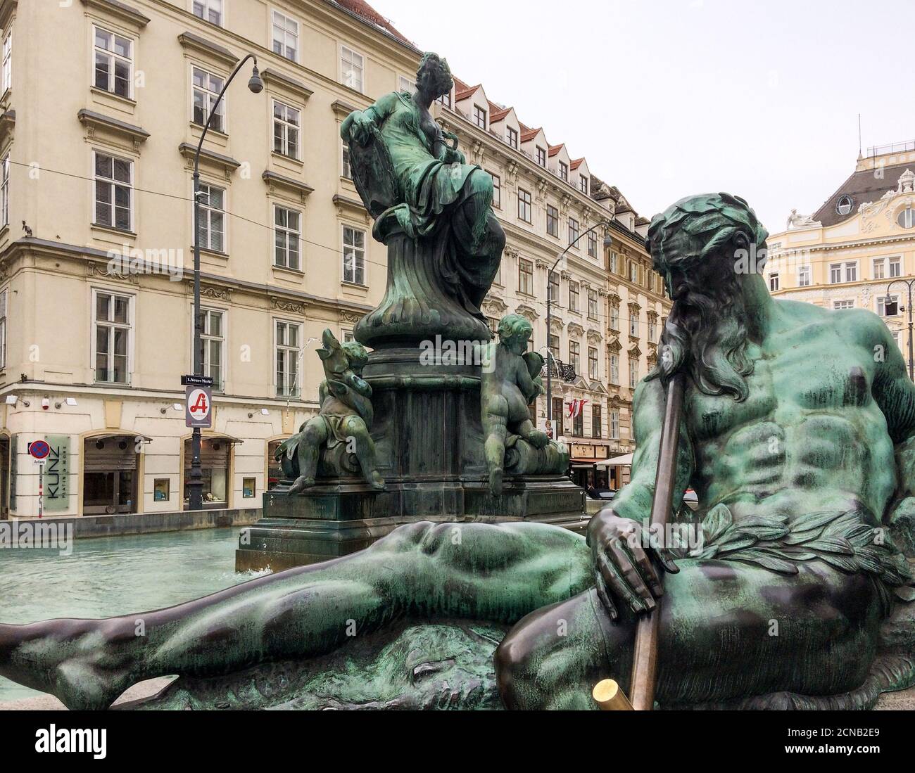Austria, Vienna, 15/04/2017 fountain with bronze statues on a street ...