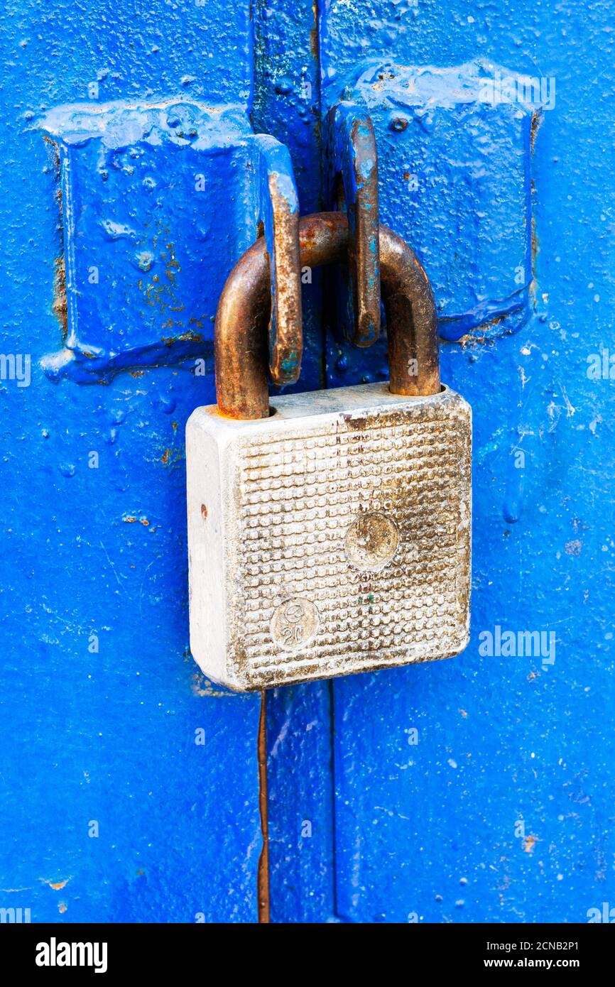 old iron castle on a blue iron gate Stock Photo - Alamy