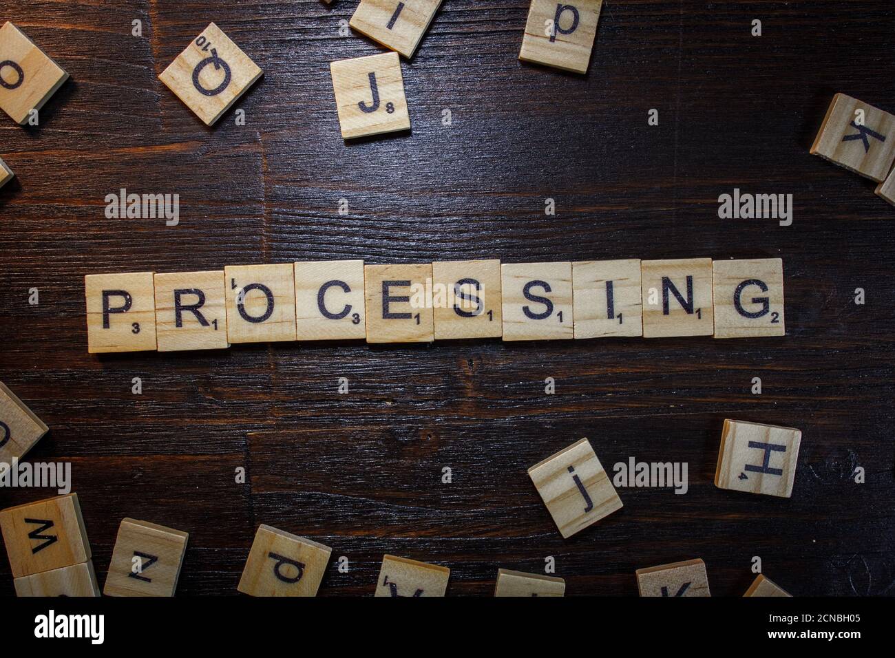 Word or phrase Processing made with scrabble letters on black table ...